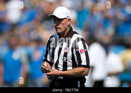 College football referee Jerry Magallanes stands on the field during ...