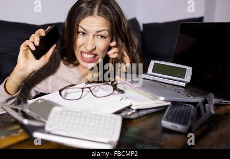business woman surrounded by technology telecommunications, mobile ...