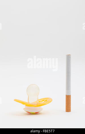 pacifier and cigarette Stock Photo - Alamy