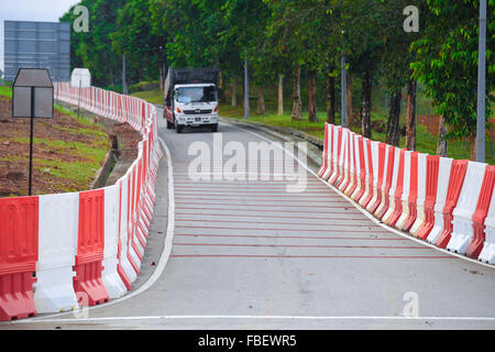 Road barriers erected along the work in progress construction area ...