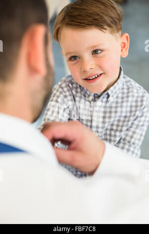 Man smiling with his son Stock Photo - Alamy