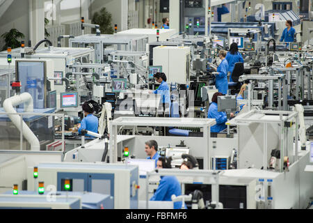 Amberg, Germany. 13th Jan, 2016. Employees are busy working on the ...