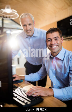 Business people working on computer Stock Photo - Alamy