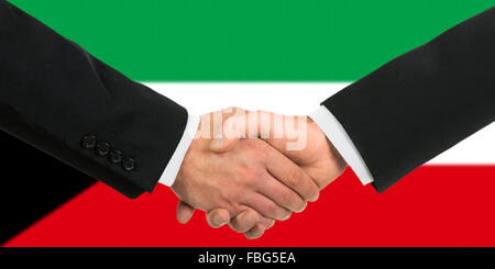 The Kuwaiti flag and business handshake Stock Photo - Alamy