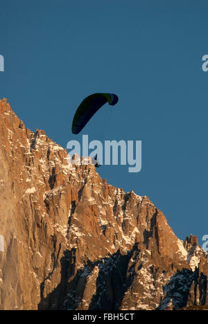 Paraglider with a mountain ridge on a sunny day as background Stock ...