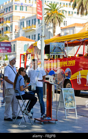 Tour operators selling excursion tickets on the street in the Old Town ...
