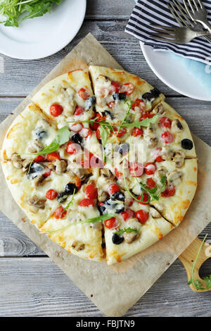 delicious hot pizza on the board Stock Photo - Alamy