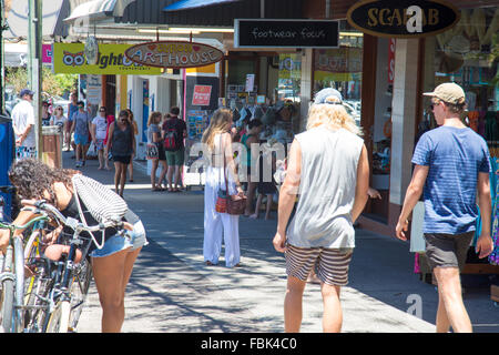 Byron Bay town centre with teenagers on summer holiday and local shops ...