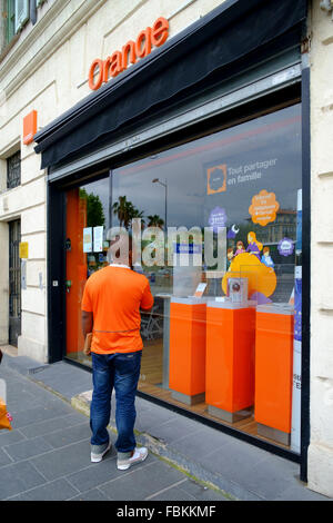 Man in a blue shirt does window installation Stock Photo - Alamy