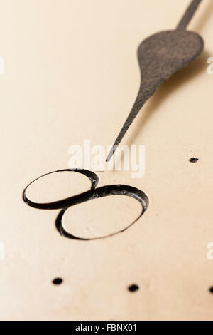 Clock hand pointing eight o'clock on white clock face of Twin bell ...