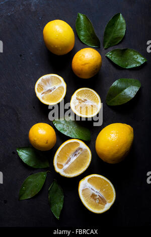 Lemon sliced slate background Stock Photo - Alamy