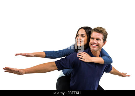 Cheerful couple with arms outstretched Stock Photo - Alamy