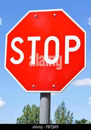 Blank triangle warning road sign with blue sky background ...
