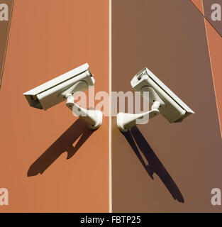 Surveillance cameras attached to a corner Stock Photo - Alamy