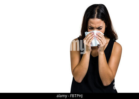 A sad woman crying and blowing her nose Stock Photo - Alamy