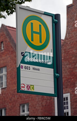 GERMANY Berlin Bus and tram stop sign, green H within yellow circle ...