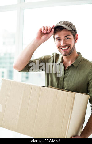 Postman delivering parcel to the office Stock Photo - Alamy
