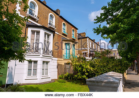 Facade of Victorian residential town houses made in yellow brick in a ...