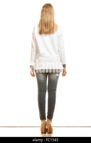 Back view of fashion model in silk dress walking on podium during ...