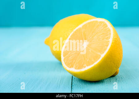 Fresh Yellow Lemons On Turquoise Table Stock Photo - Alamy