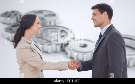 Composite image of future partners shaking hands Stock Photo - Alamy
