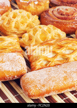 Various crusty bread and buns on blackboard background. Top view with ...
