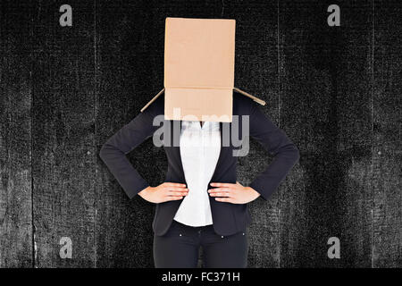 Composite image of businesswoman with box over head Stock Photo - Alamy