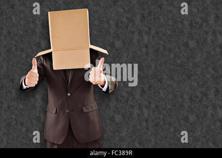 Composite image of anonymous businessman with thumbs up Stock Photo - Alamy