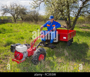 Tractor driver in sitting in agriculture tractor cabin Stock Photo - Alamy
