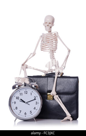 Skeleton with alarm clock on the white Stock Photo - Alamy