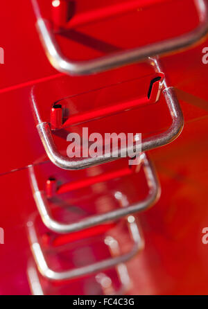 Red file cabinet with drawers Stock Photo - Alamy