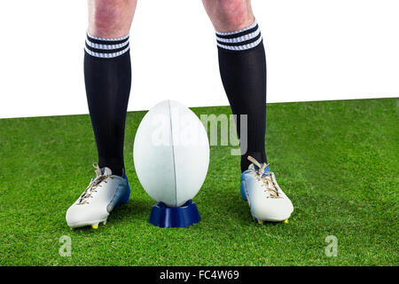 Rugby player ready to make a drop kick Stock Photo - Alamy