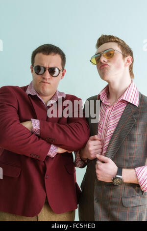 Two handsome guys friends are smiling for the selfie they are taking ...