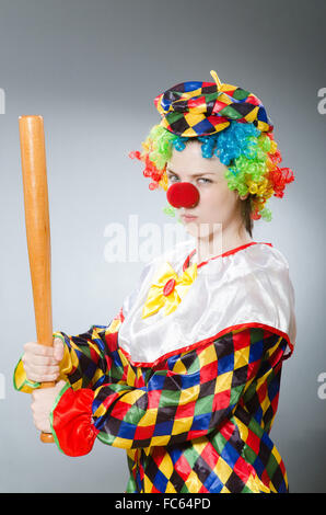 Clown with baseball bat in funny concept Stock Photo - Alamy