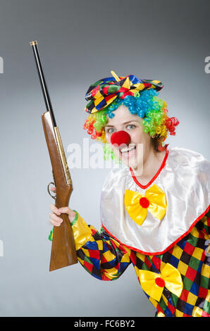 Clown with rifle isolated on white Stock Photo - Alamy