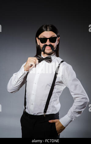 Man with moustache and sunglasses against gray Stock Photo - Alamy