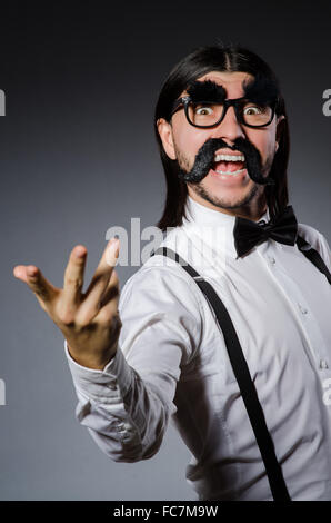 Man with moustache and sunglasses against gray Stock Photo - Alamy