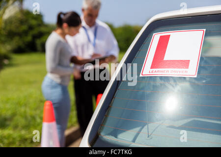 Student driver (learner driver) sign on top of driver training car ...