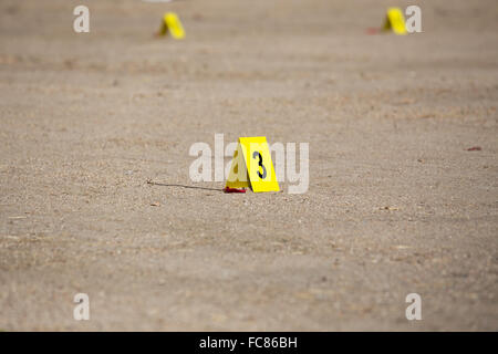 yellow evidence number tag in car bomb crime scene Stock Photo - Alamy