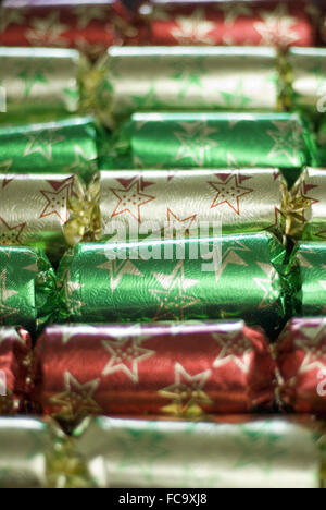 Metallic red and gold Christmas crackers Stock Photo - Alamy