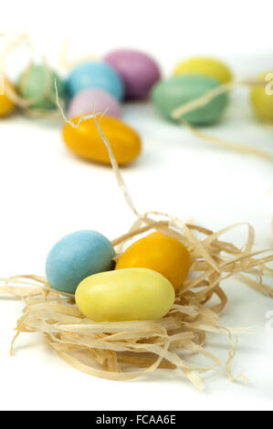 Small multicolored eggs white isolated Stock Photo - Alamy