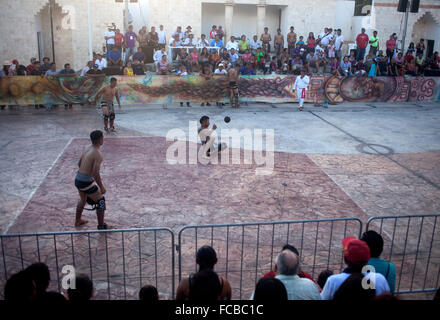 A player hits the ball with his hip during a match of Mayan Ball Stock ...