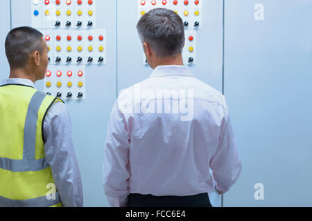 Manager supervisor, engineer and industrial worker in uniform ...