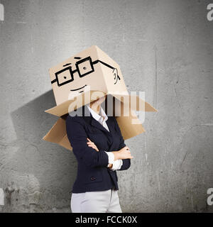 Conceptual image of businesswoman with carton box on head Stock Photo ...