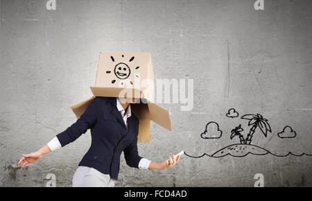 Businesswoman in suit wearing carton box on head Stock Photo - Alamy