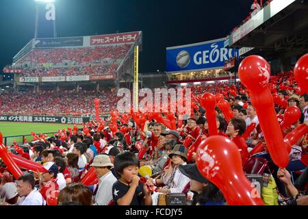 Japanese baseball fans of Hiroshima Carp cheer their team on at ...
