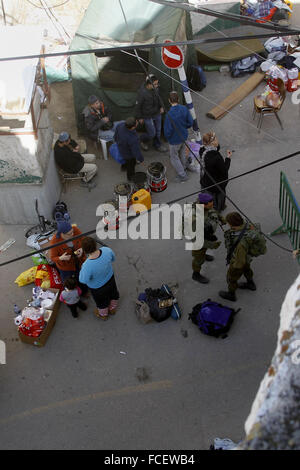Palestinians collect belongings from their evacuated homes in the ...