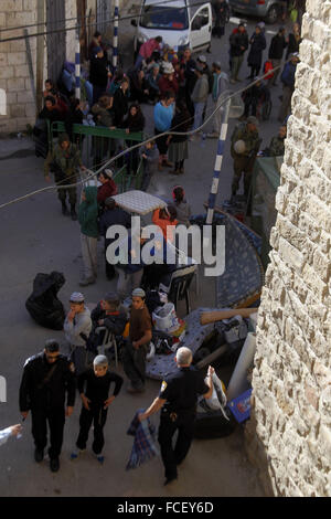 Palestinians collect belongings from their evacuated homes in the ...
