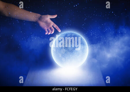 Close of man hands touching moon planet Stock Photo - Alamy