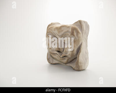 Clay sculpture of angry sleeping scrunched up face on white background ...